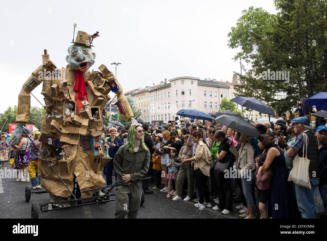 Sculpture by the Artistania group next to spectators with umbrellas at ...