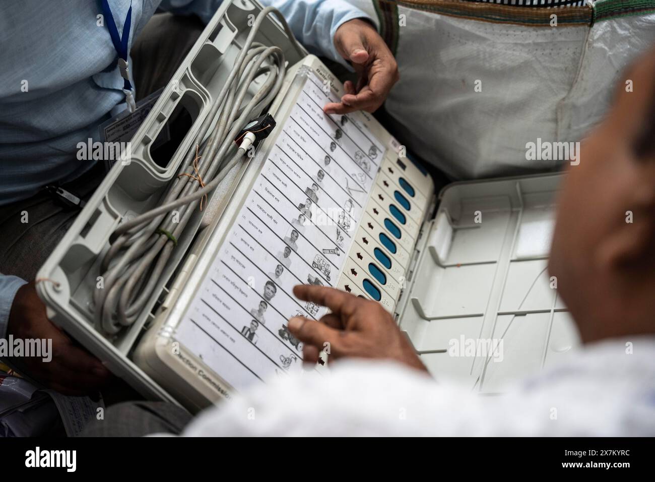 Barpeta, India. 6 May 2024. Polling officials check Electronic Voting ...