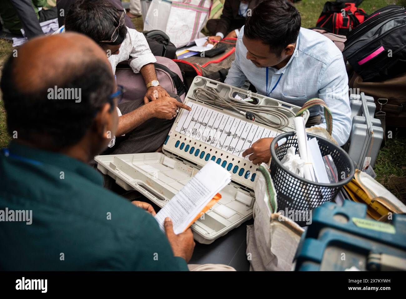 Barpeta, India. 6 May 2024. Polling officials check Electronic Voting ...