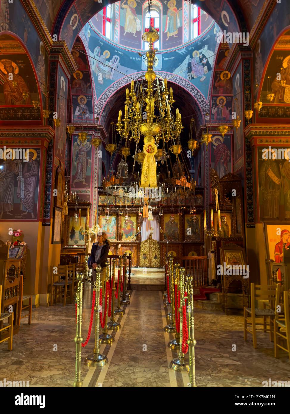Tourist visiting sanctuary interior of orthodox church with in ...