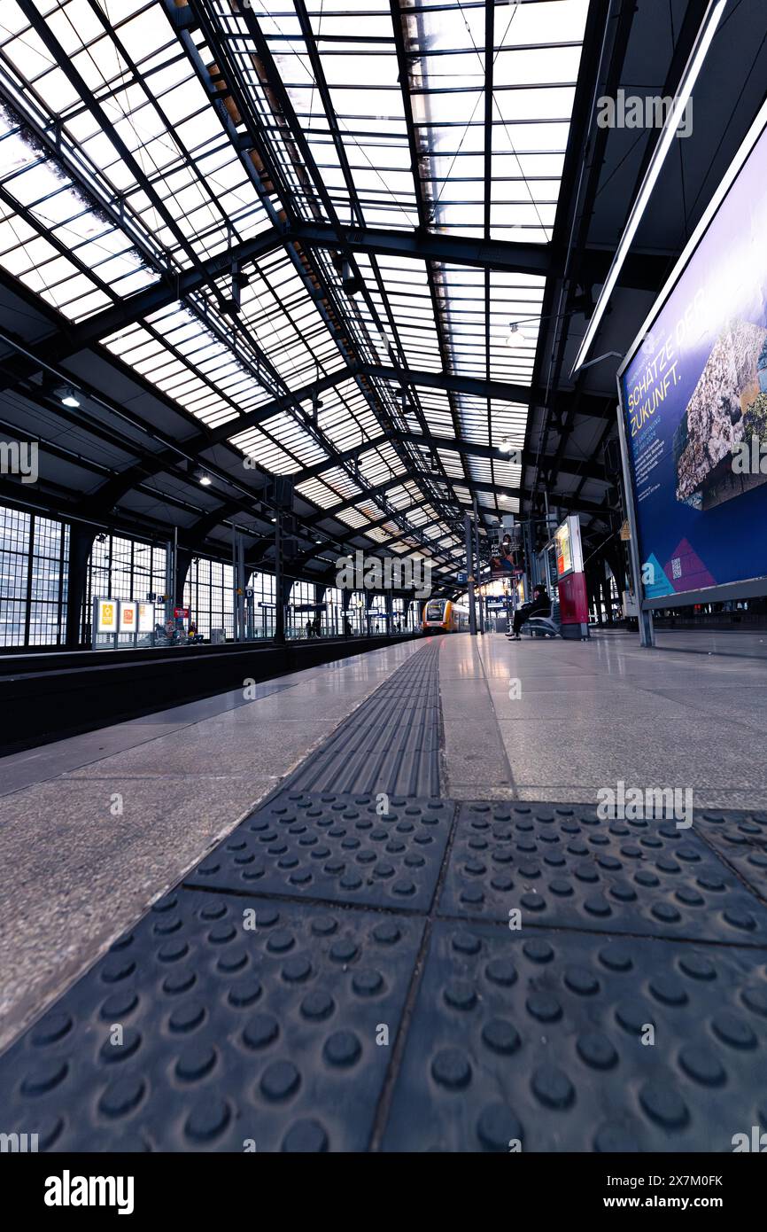 Railway station with glass roof, modern lighting and tracks, Berlin, Germany Stock Photo - Alamy