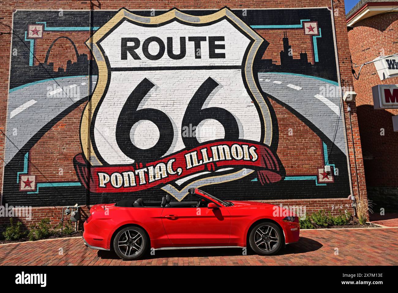 Red Ford Mustang convertible in front of the mural with the motif Route ...