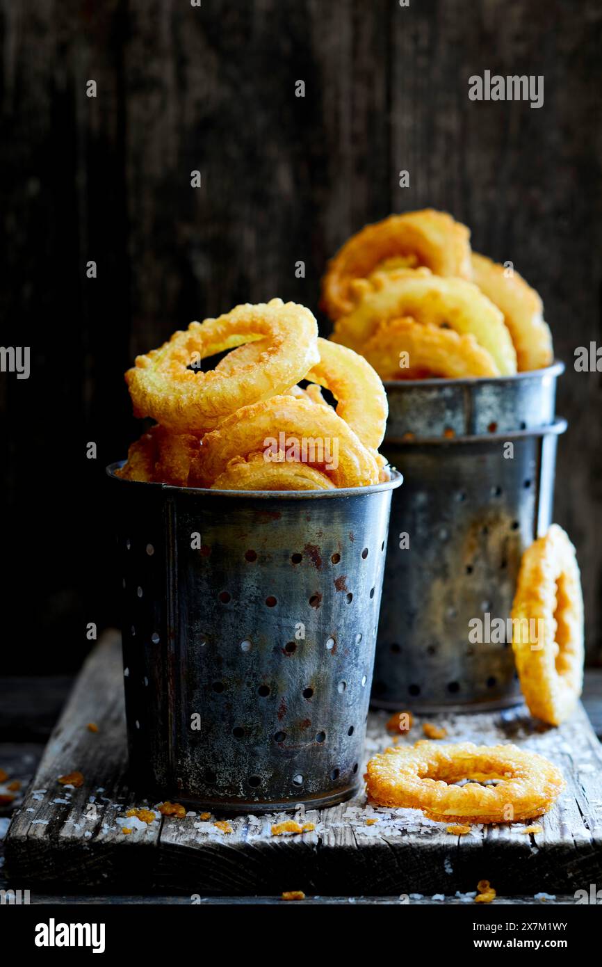 Homemade crunchy fried onion rings in a metal cup Stock Photo - Alamy