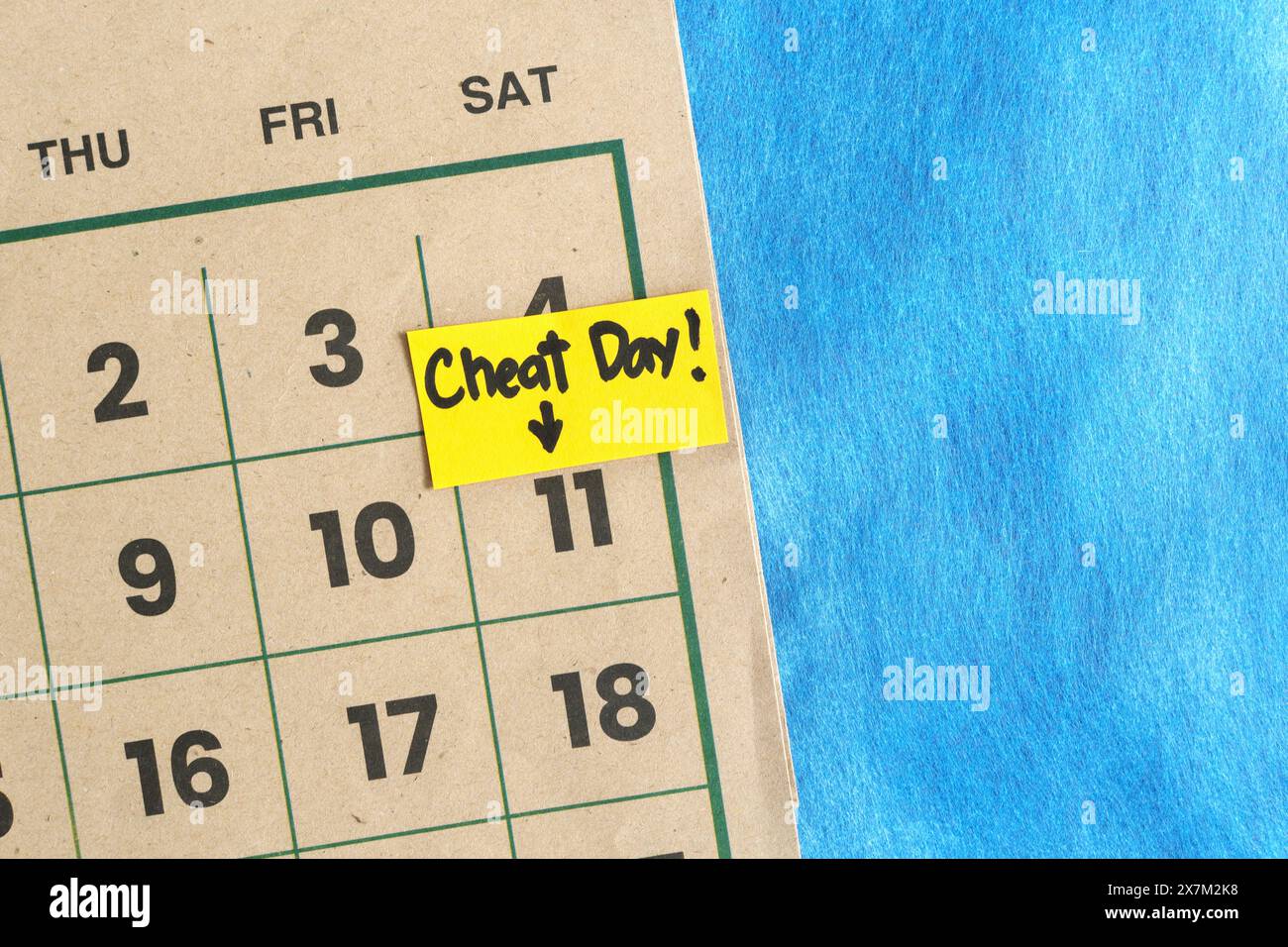 Cheat day concept. Written reminder note on a calendar Stock Photo - Alamy