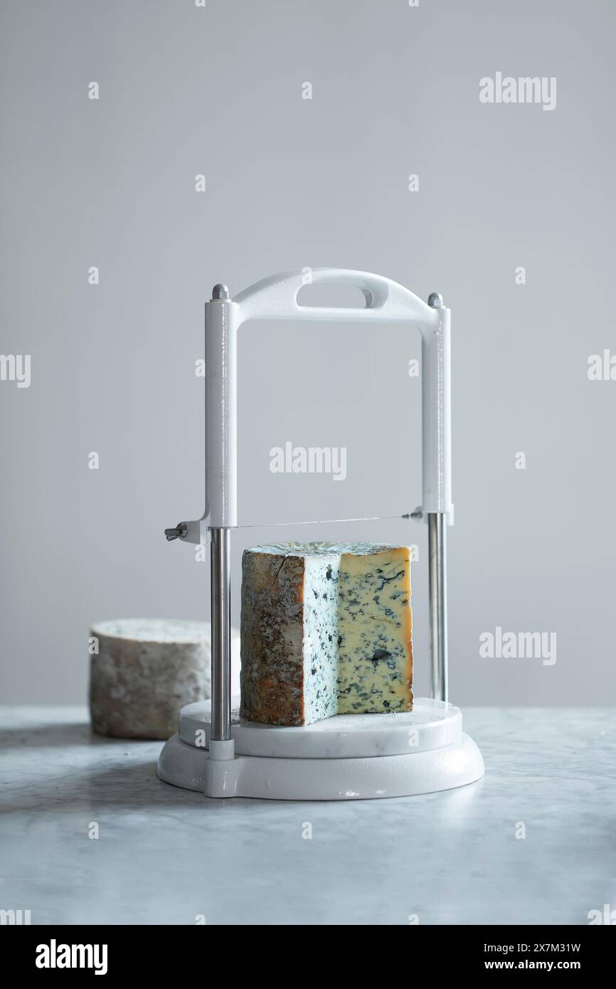 Sliced blue cheese on a cheese guillotine Stock Photo - Alamy