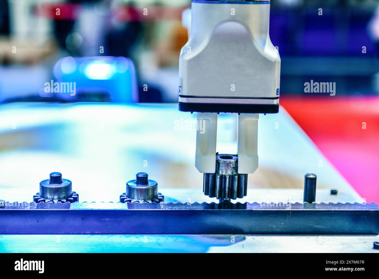 Modern Robot Arm automation system moving metal gear parts in factory, industrial robot concept ...