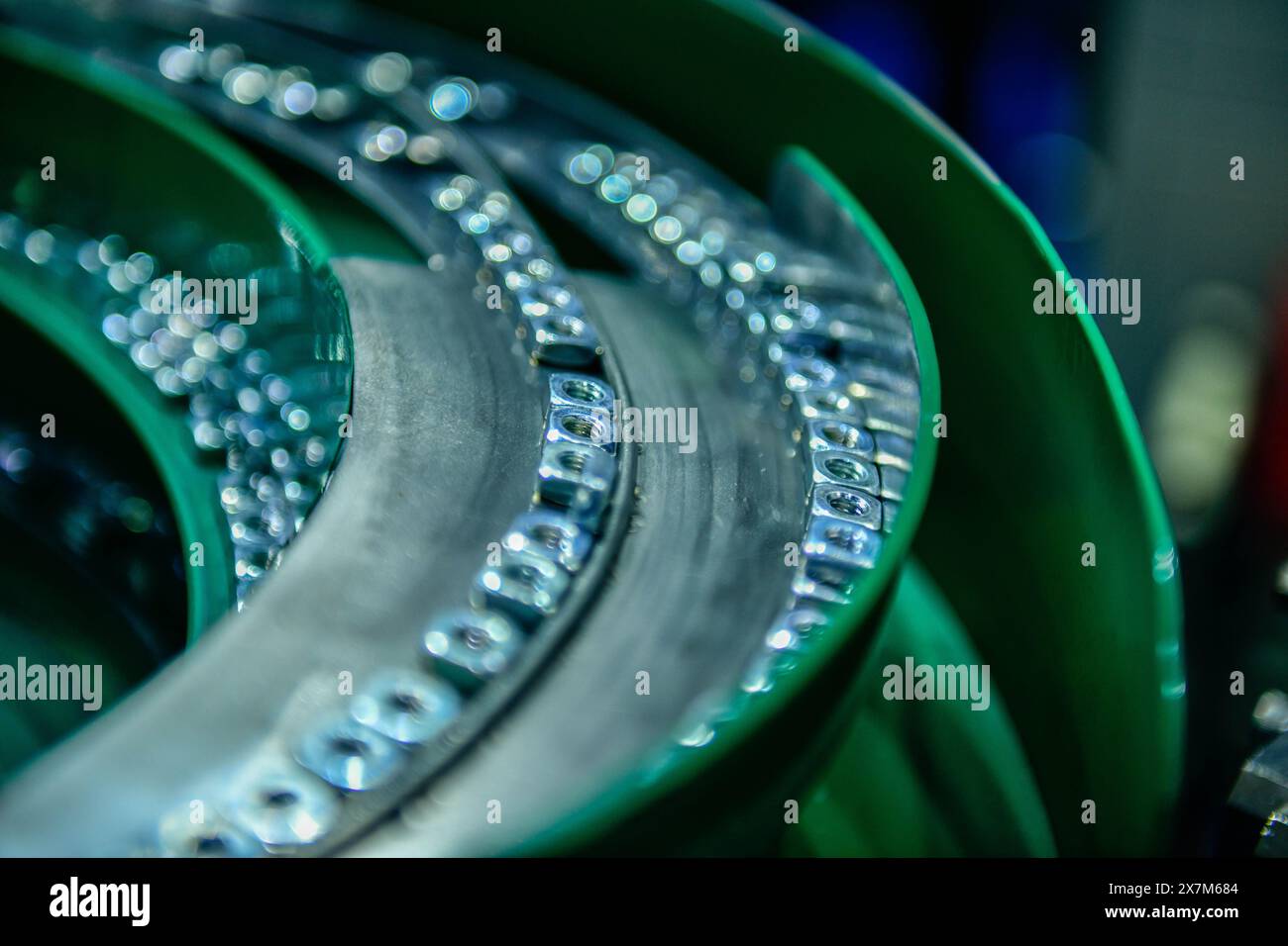 Many small nuts by manufacturing process in factory Stock Photo - Alamy