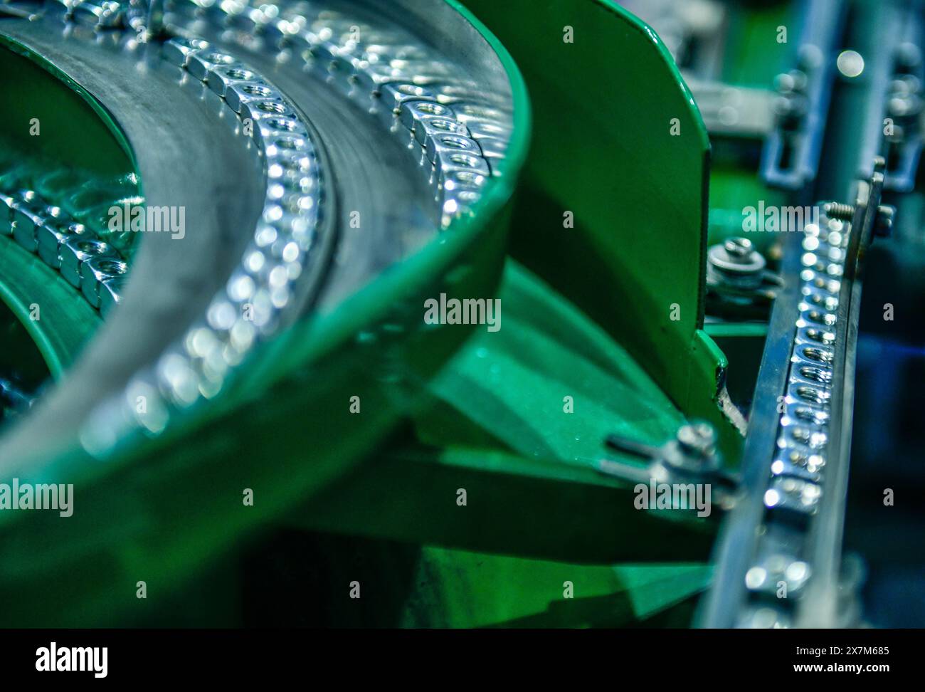 Many small nuts by manufacturing process in factory Stock Photo - Alamy