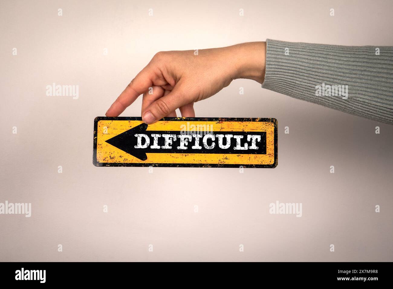 Difficult Decision Concept. Arrow with text in woman's hand on white ...