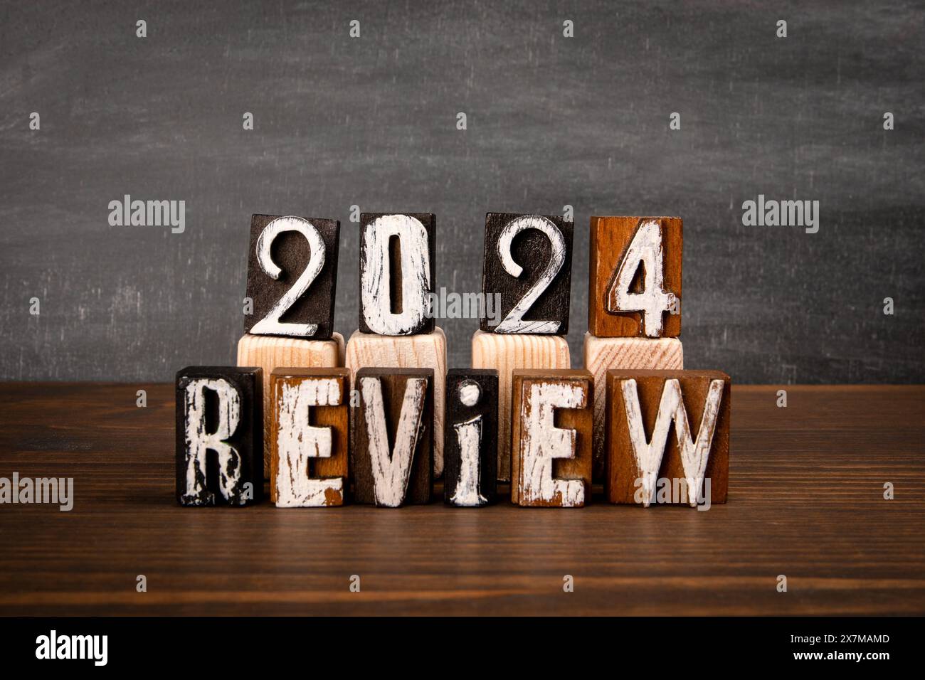 2024 Review. Alphabet blocks on wooden texture table Stock Photo - Alamy