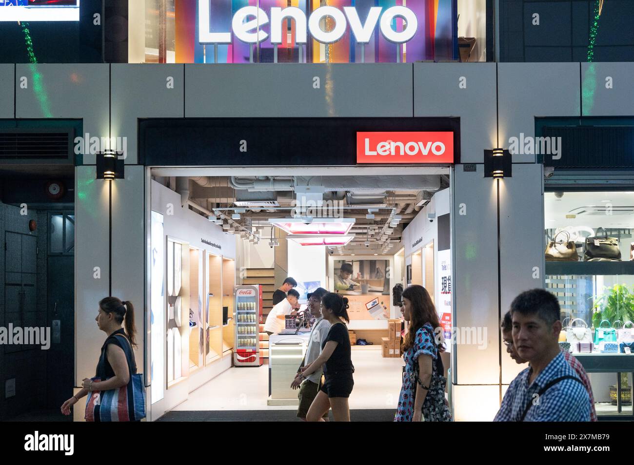 Hong Kong, China. 20th May, 2024. Pedestrians walk past a Chinese ...