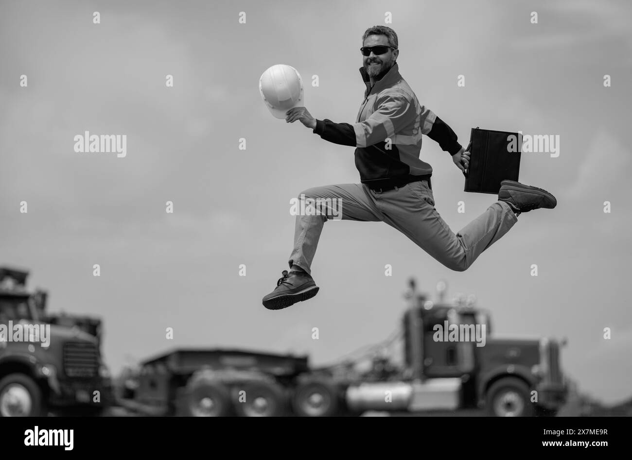 Crazy builder excited jump on site construction. Excited builder ...