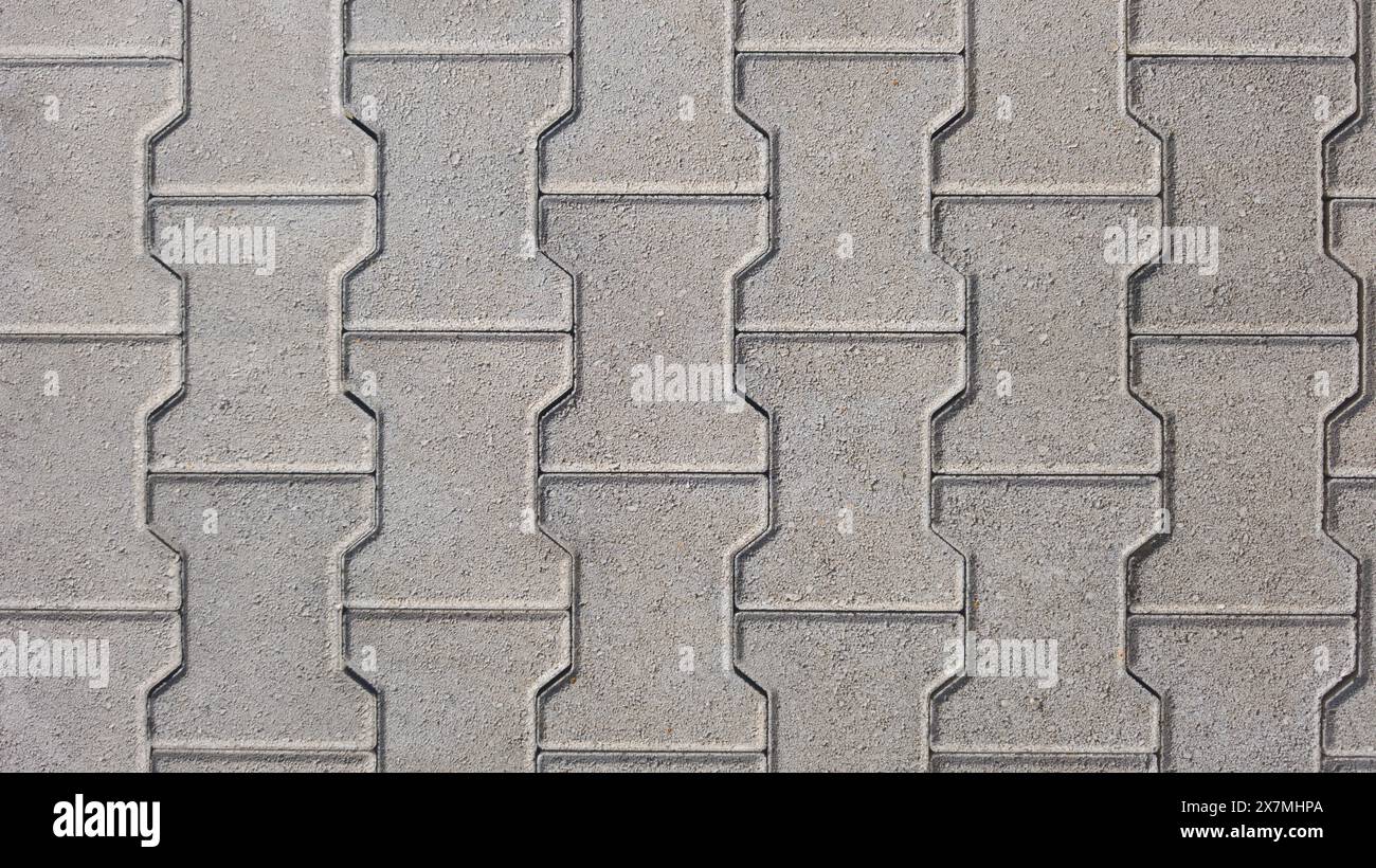 interlocking block paving background beige grey Stock Photo - Alamy