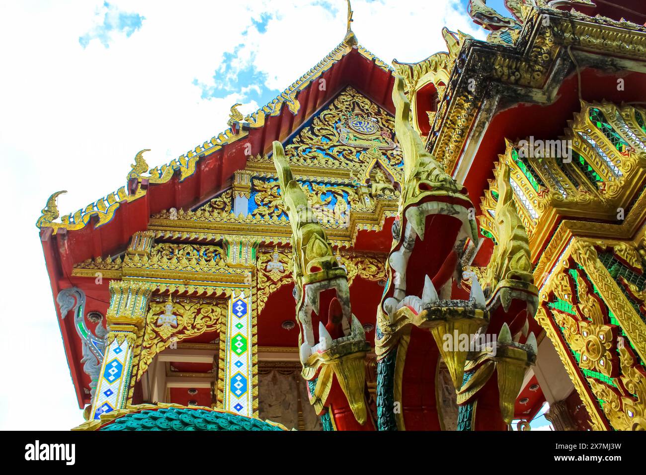 Buddhist temple Wat Kaew Manee Si Mahathat at sunny day in Phang Nga, Thailand, vertical ...