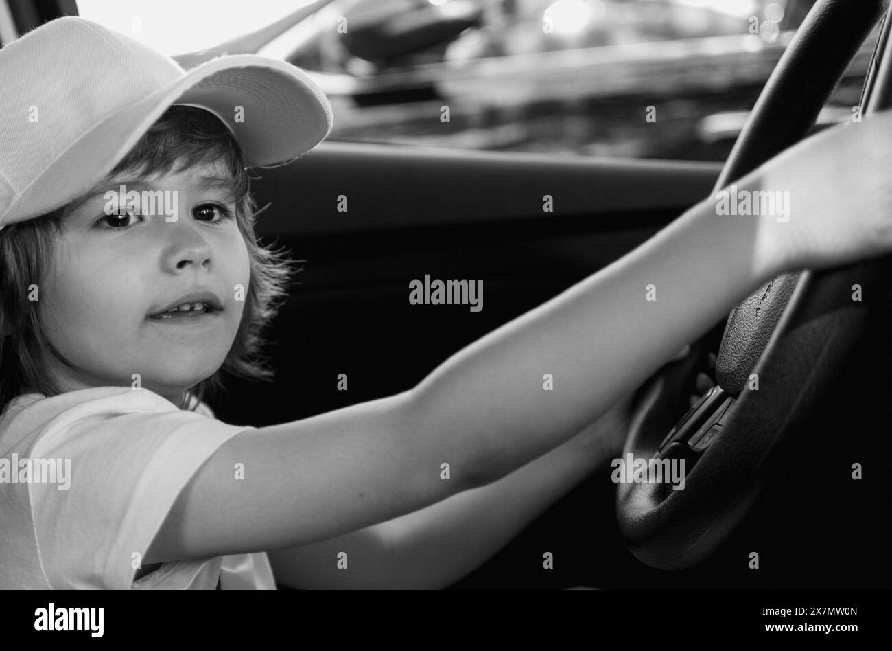 Little Driver. Cute little boy pretending to drive. Kid in car with his ...