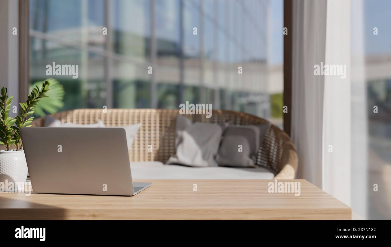 A laptop computer on a minimal wooden coffee table in a beautiful ...