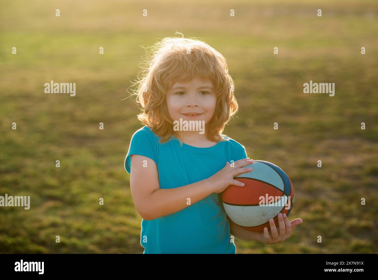 Kid playing basketball. Activity and sport for kids Stock Photo - Alamy