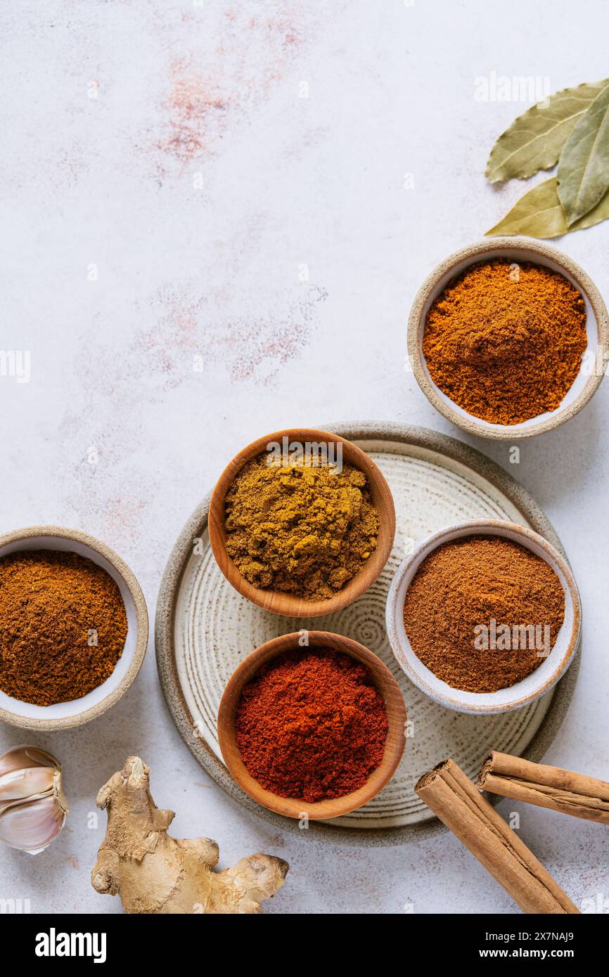 Ground spices in bowls on a neutral background background Stock Photo ...