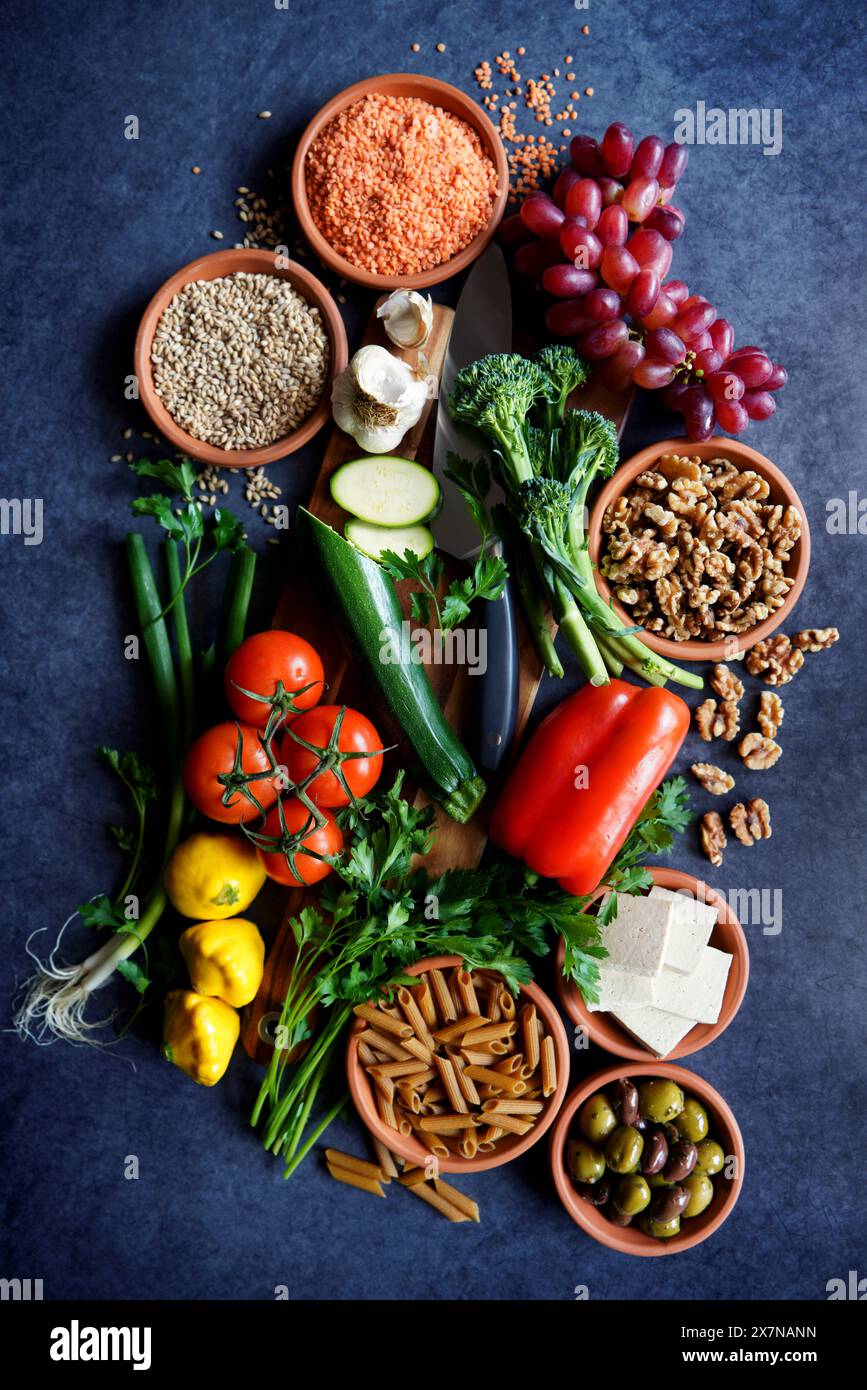 Plant-based whole food diet raw ingredients including fruit, vegetables ...
