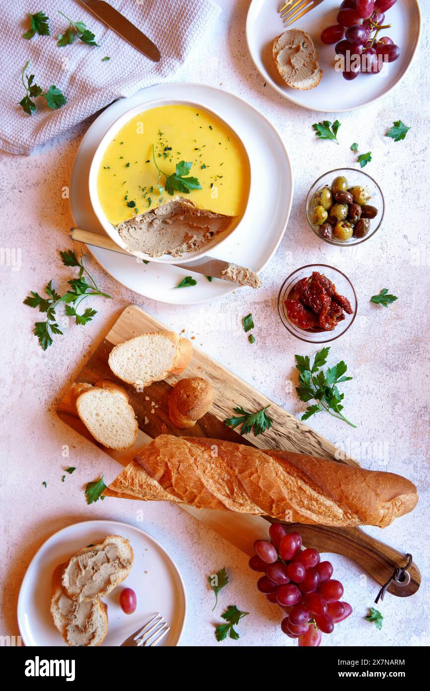 Chicken liver pate served with crusty French baguette bread, olives ...
