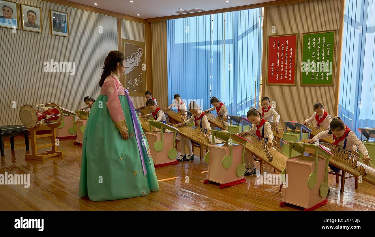 a group of children and teenagers, pioneers, in the Mangyongdae ...