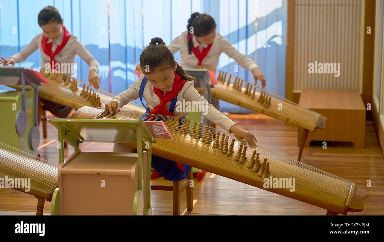 a group of children and teenagers, pioneers, in the Mangyongdae ...
