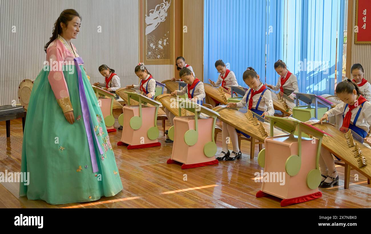 a group of children and teenagers, pioneers, in the Mangyongdae ...