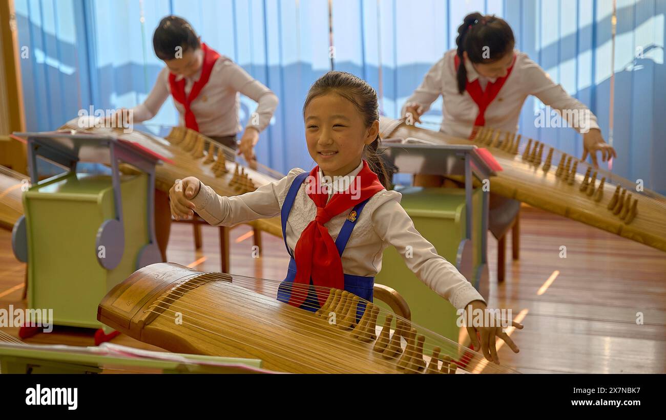 a group of children and teenagers, pioneers, in the Mangyongdae ...
