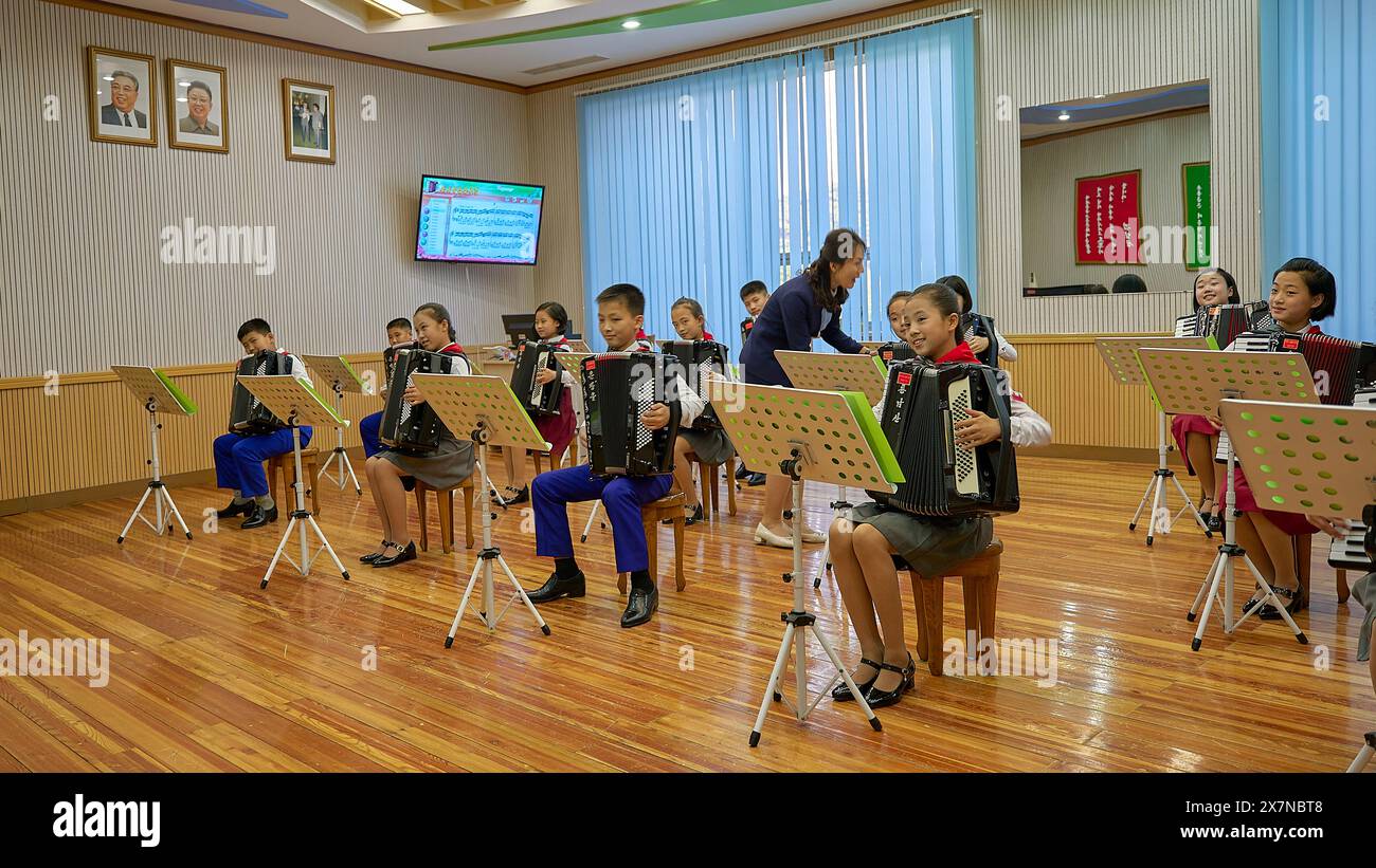 a group of children and teenagers, pioneers, in the Mangyongdae ...