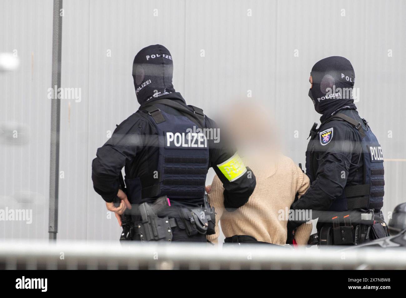 21 May 2024, Hesse, Frankfurt/Main: Special police forces lead a ...