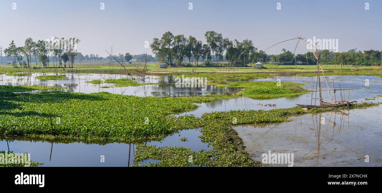 Scenic rural landscape panorama with wooden boats and traditional ...