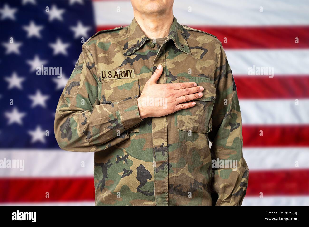 An American soldier man pledging allegiance in front of his country's ...