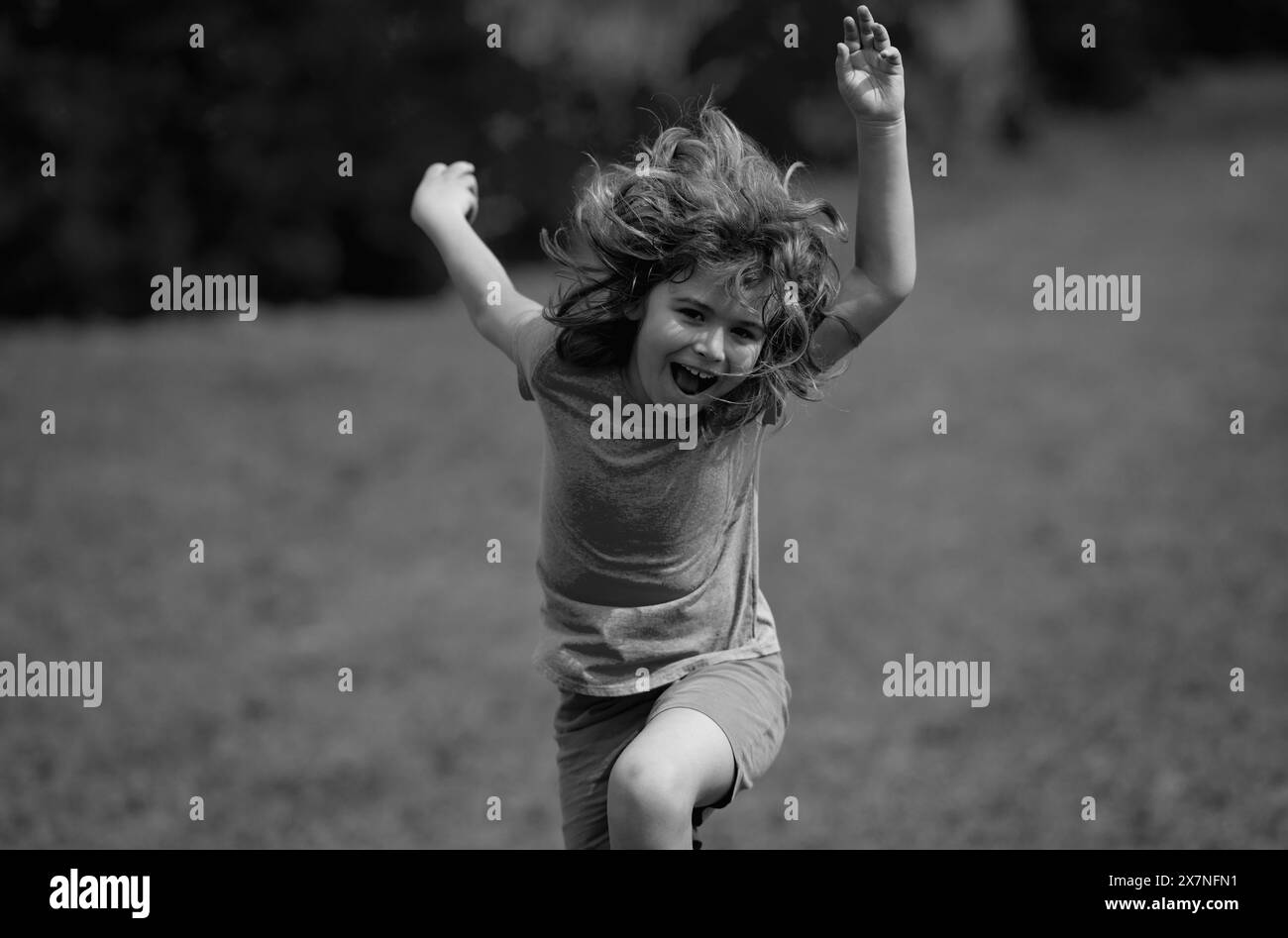 Excited Kid running in street. Amazed child enjoy run. Happy little boy ...