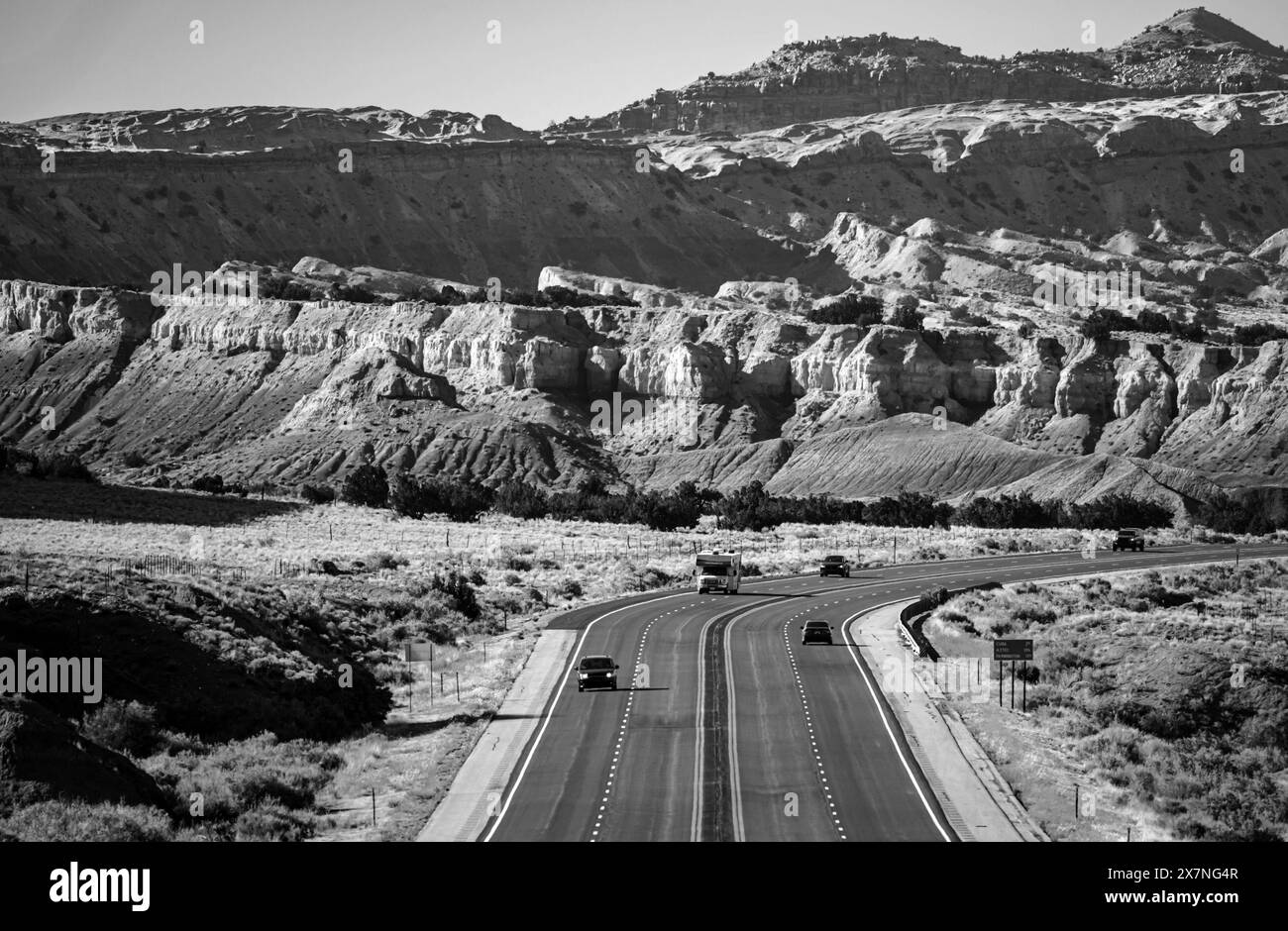 Asphalt highway and hill landscape under the blue sky. Curved Arizona ...