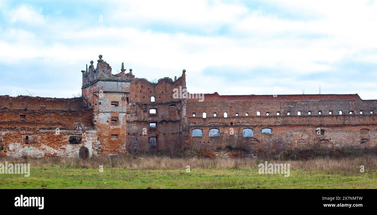 The old ruins of the collapsed walls with gates and windows ...