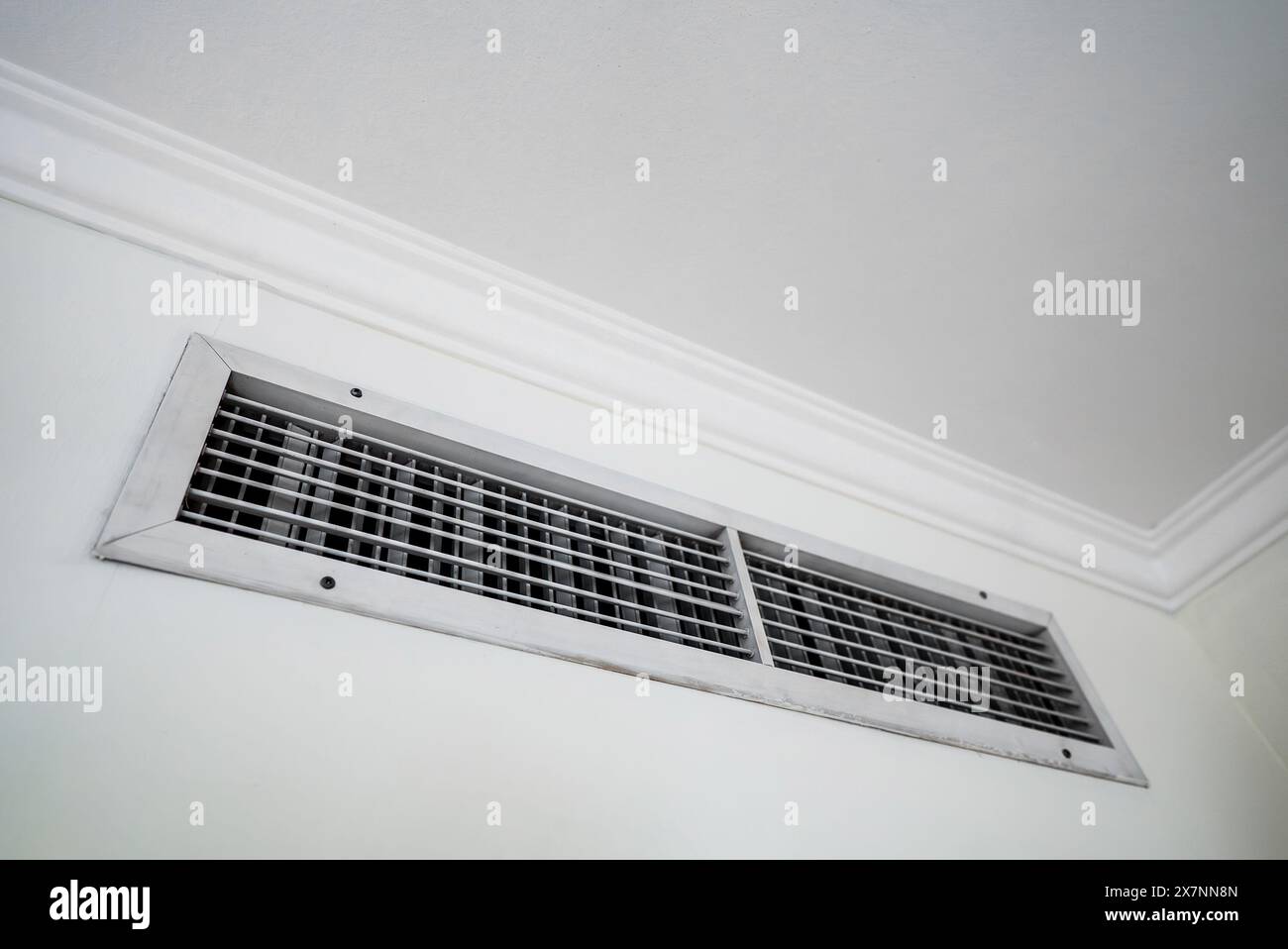 Ventilation grill in the room. Built-in air conditioner Stock Photo - Alamy