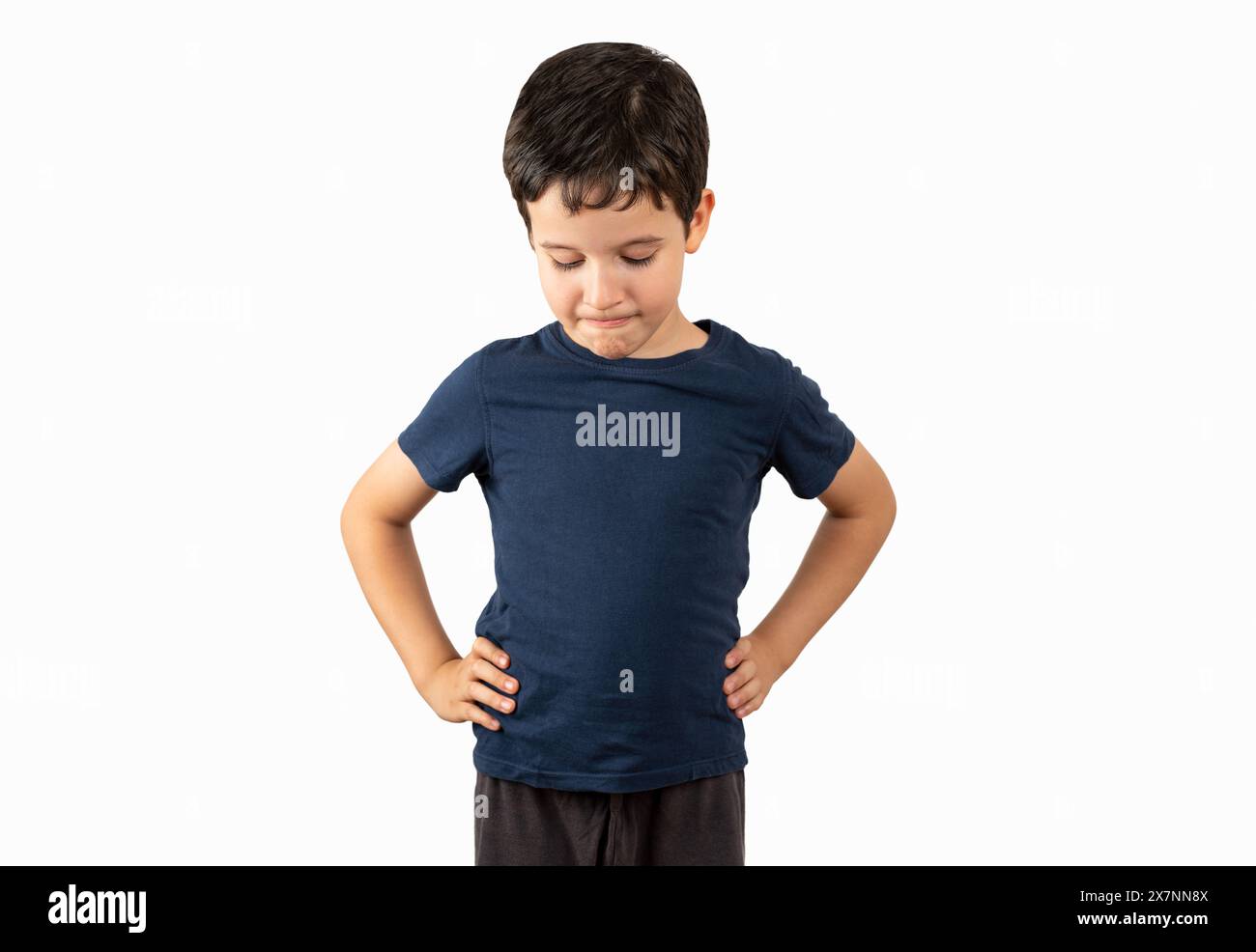 Child standing over white background failure and looking down in ...