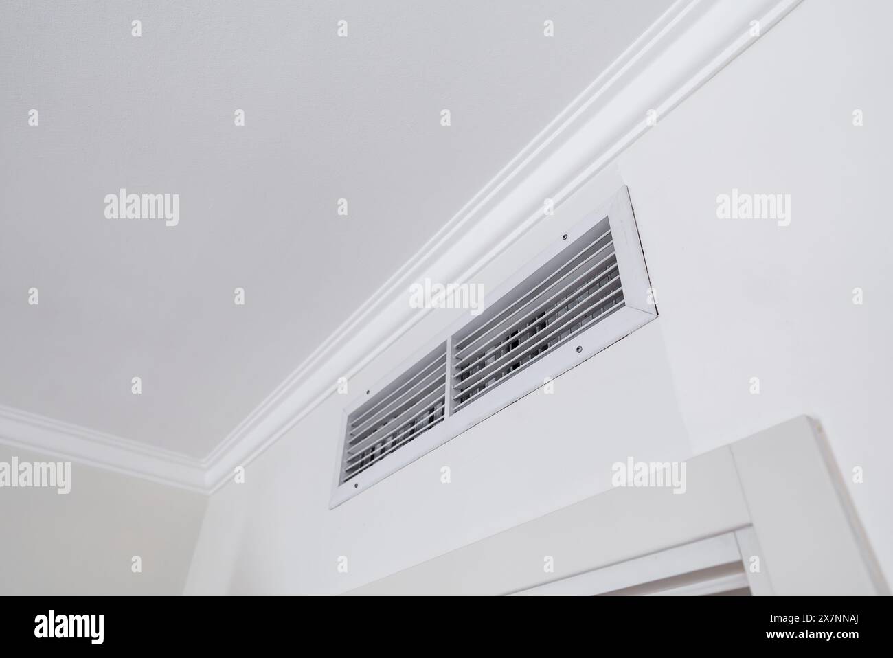 Ventilation grill in the room. Built-in air conditioner Stock Photo - Alamy