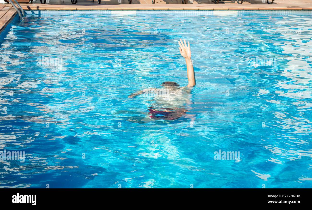 close up of hand drowning in a pool of water Stock Photo - Alamy