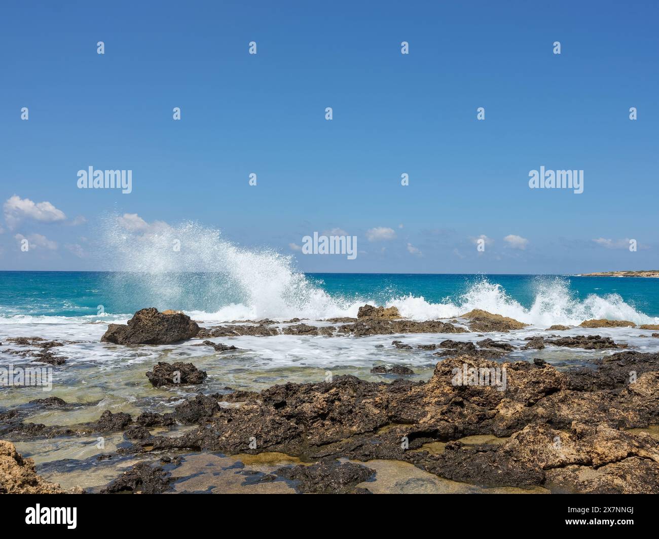 May 2024, Breaking waves over the rocks at Pegeia, Pafos, Cyprus Stock ...