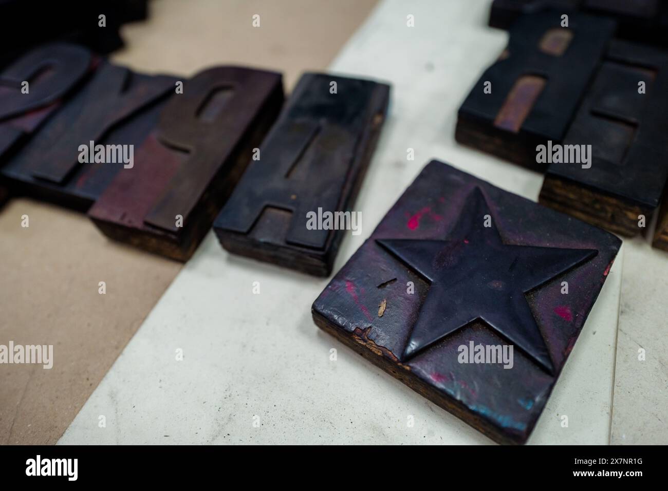 The movable letterpress "star" sign is seen placed along with other ...