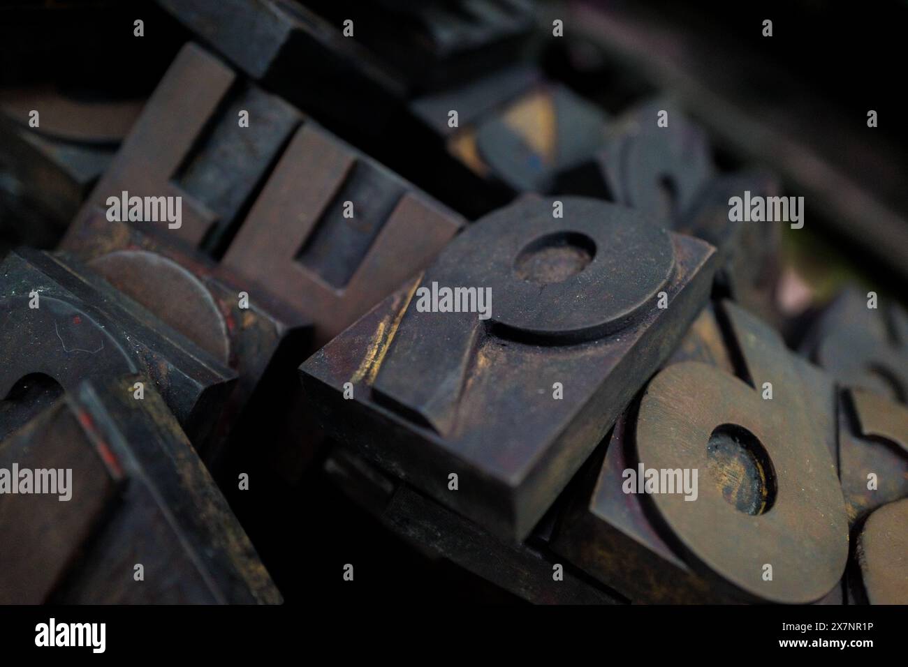The movable wooden letterpress types are seen randomly stored in a tray ...