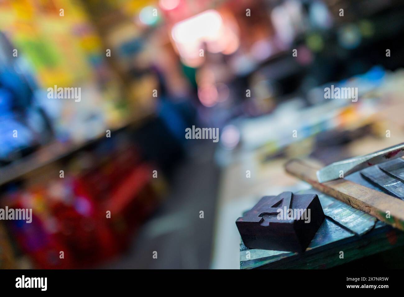 The movable letterpress type "A" is seen placed on the composing table ...