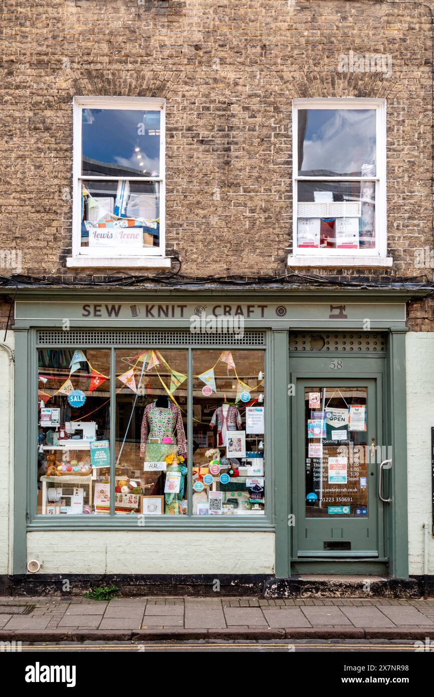 A charming storefront of a craft shop called 'Sew Knit Craft' featuring ...