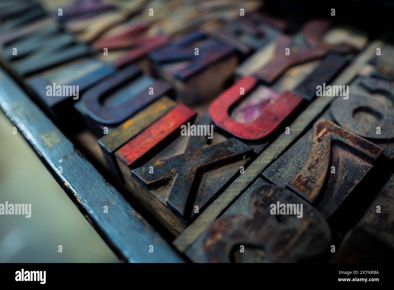 The movable wooden letterpress types are seen stored in a tray at an ...