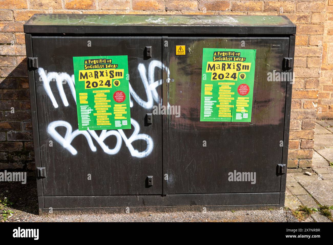 Electrical box covered in posters for Marxism 2024 festival of ...