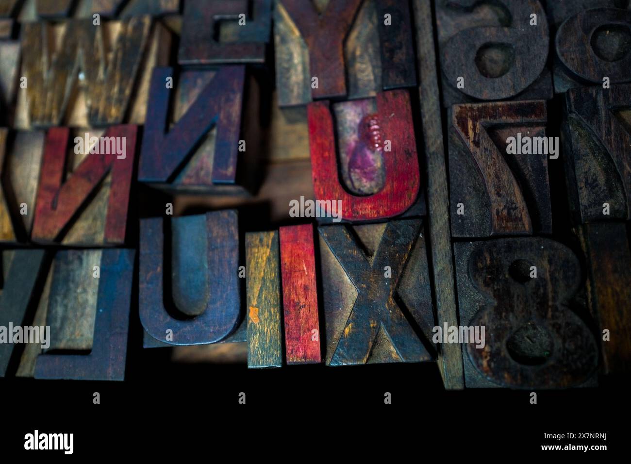The movable wooden letterpress types are seen stored in a tray at an ...