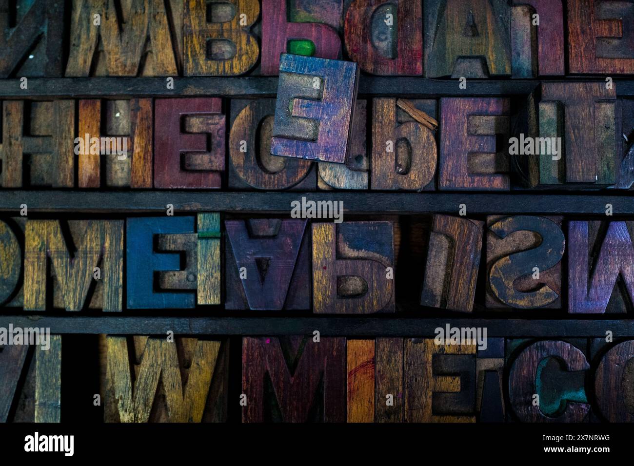 The movable wooden letterpress types are seen stored in a tray at an ...