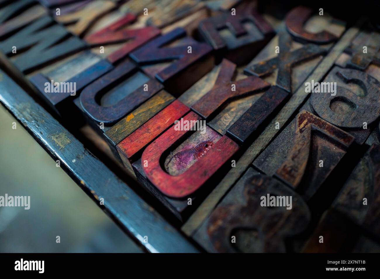 The movable wooden letterpress types are seen stored in a tray at an ...