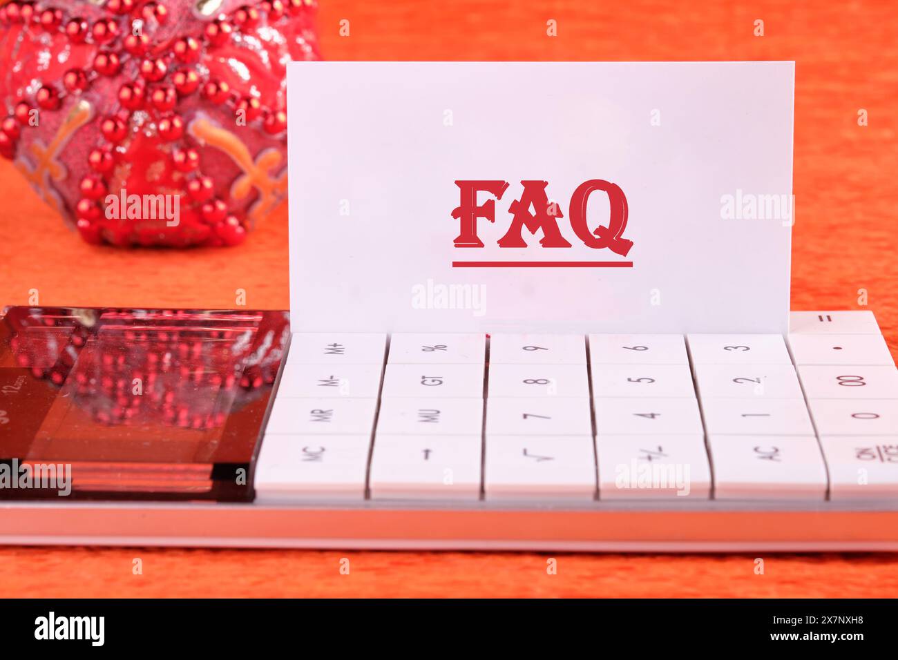 FAQ (Frequently Asked Questions) symbol on a white business card with a calculator Stock Photo ...